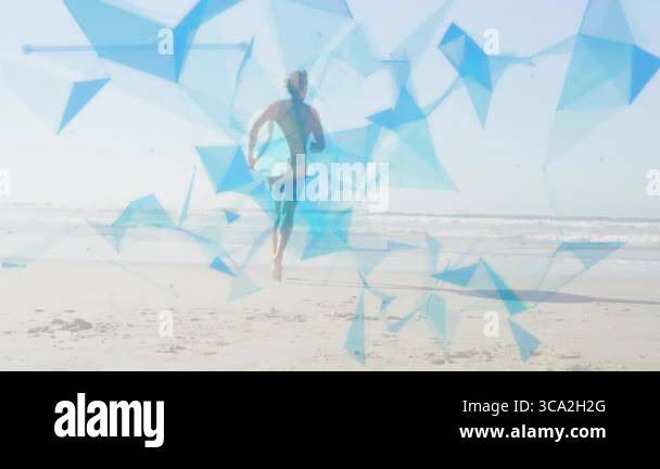 Man walking barefoot along sandy beach, with floating blue triangles ...