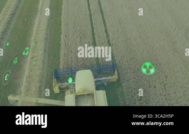 Combine harvester header cutting through wheat field, showing energy ...
