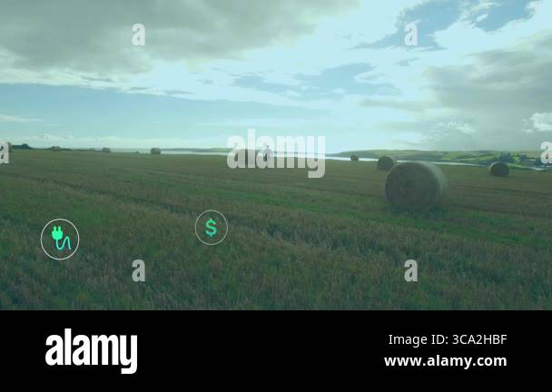 Harvested field showing floating wind turbine, recycling icons over hay ...