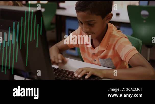 Boy tapping keyboard and generating colored waveforms visualizing audio feedback in school lab ...