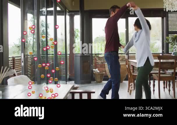 Dancing couple spinning in modern living room, highlighting social ...