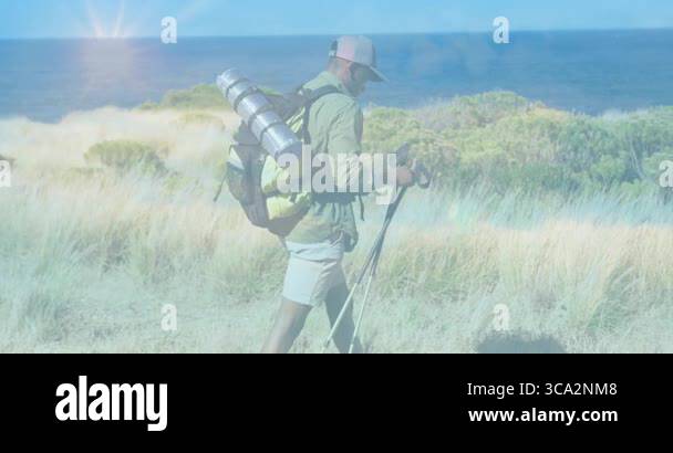 Man adjusting hiking poles on coastal dune trail, showing animated ...
