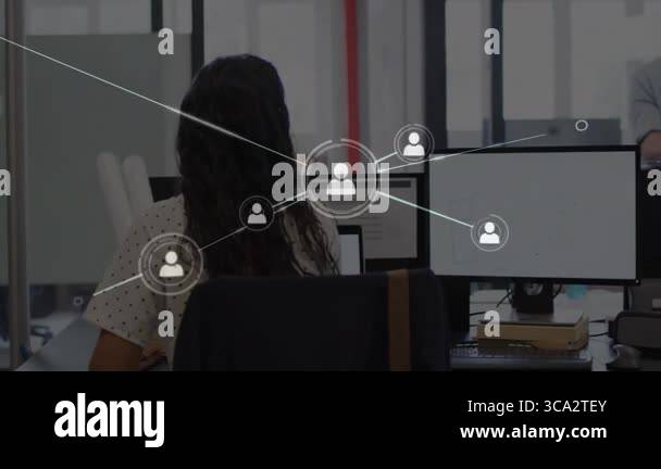 Woman handing rolled plans to male colleague in architecture workspace with animated network ...