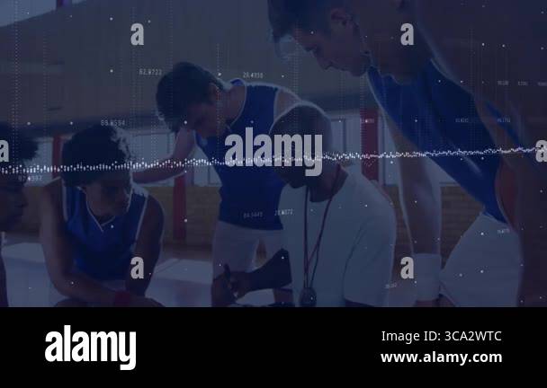 Coach drawing play on clipboard during basketball training huddle ...