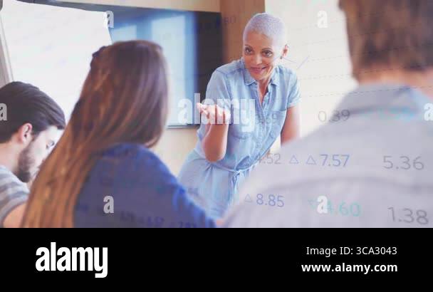 Instructor facilitating business training in conference room displaying ...