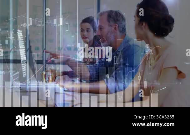 Team typing, smiling, leaning at desk in office, with animated finance ...