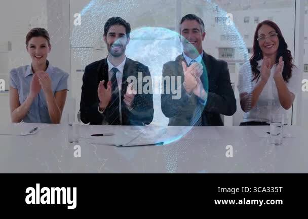 four professionals clapping around table, displaying digital globe ...