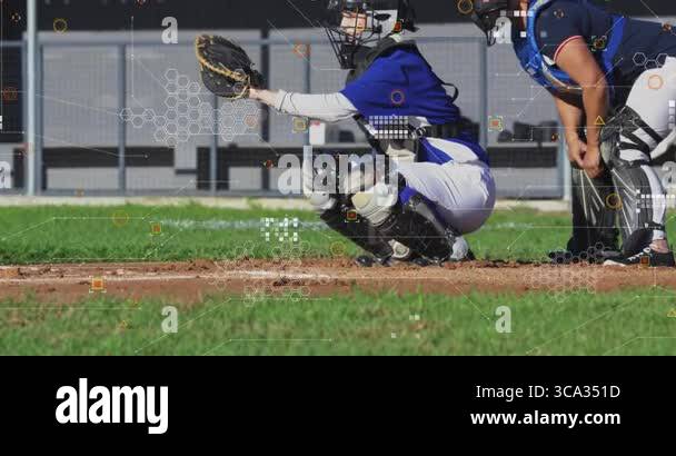 Female catcher and umpire crouching behind home plate on baseball field ...