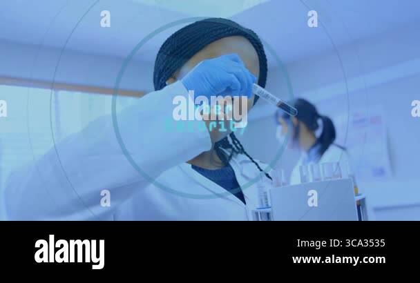 female lab technician examining blood sample holding test tube, showing ...