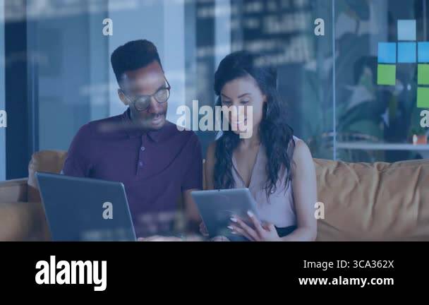 woman holding tablet and man typing laptop, showing tech code overlays ...