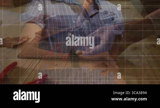 Man tapping smartphone at wooden desk, blending financial line charts ...