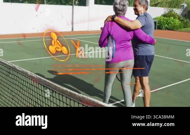 man wrapping arm around woman walking on tennis court, showing red ...
