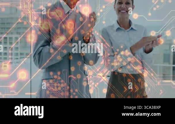 male executive and female colleague applauding in office, circuit ...