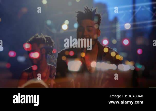 Lead singer singing into mic, backing vocalist harmonizing with bokeh ...