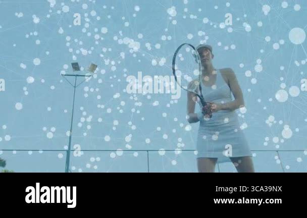 Female tennis player swinging racket on outdoor tennis court, with ...