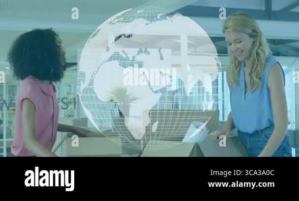 Two women unpacking documents in modern office, showcasing global ...