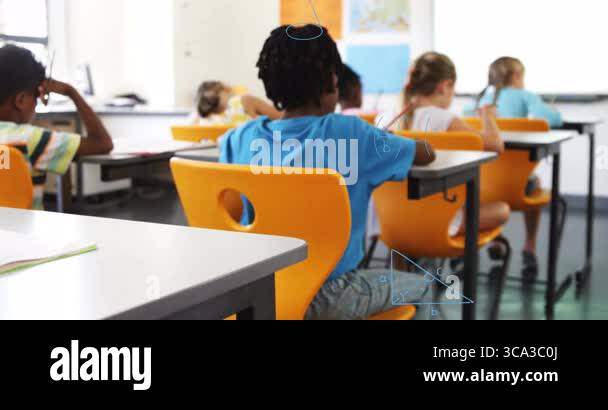 School-age boy solving geometry in classroom with animated diagrams ...