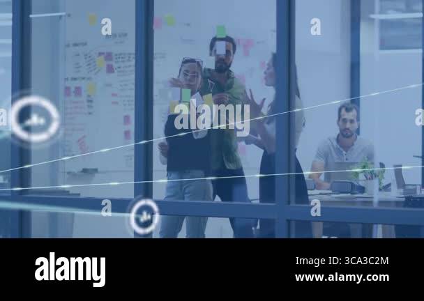 Team placing sticky notes on glass wall, finalizing plan and spawning ...