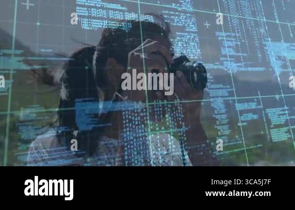 Woman operating DSLR camera capturing hills, overlaying grid and code ...