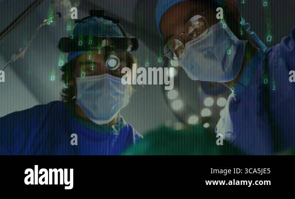 Two male surgeons using headlamp leaning over patient under surgical ...