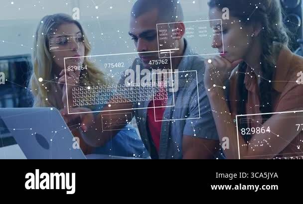 Colleagues collaborating around laptop, showing floating data panels ...