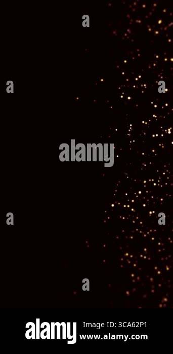Slow motion of small particles in the form of gold dust on a black ...
