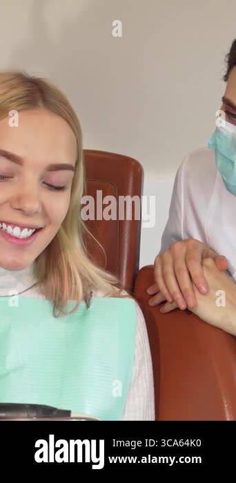 A radiant dentist and her delighted patient share a joyful moment, both ...