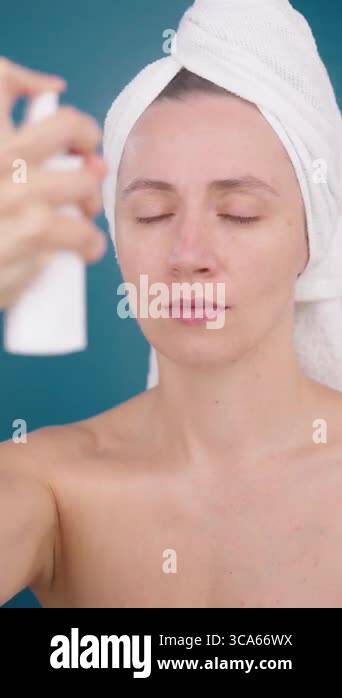 Vertical Video. Pretty Woman Sprays a Facial Spray Mist or Thermal ...