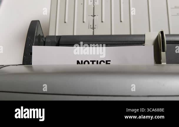 Close-up of printer printing a termination of employment notice in an ...