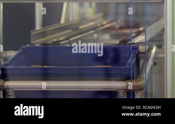 Vertical Conveyor Elevator Crate Lifting in Packaging Factory Stock ...