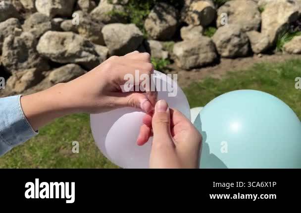 Party balloon knot Stock Videos & Footage - HD and 4K Video Clips - Alamy