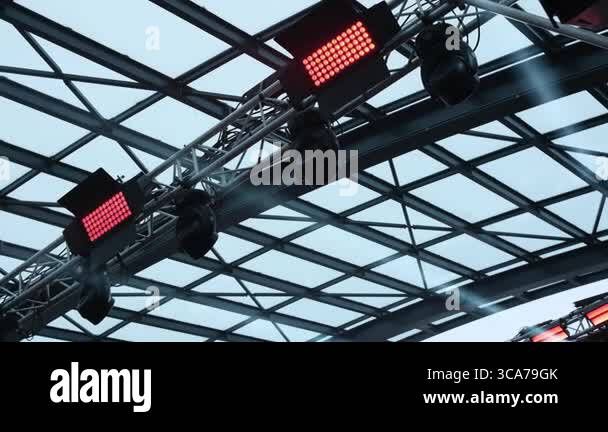 Red Stage Light Hanging From Ceiling Illuminates During Concert Stock ...