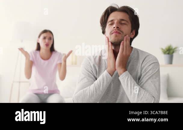 Two people experience emotional strain while discussing an issue in a ...