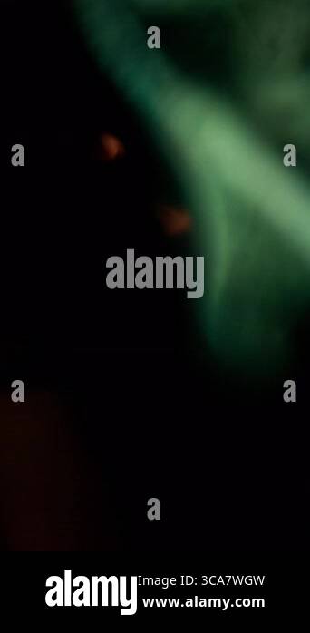Vertical video. Blur light reflection. Optical lens flare. Golden green ...