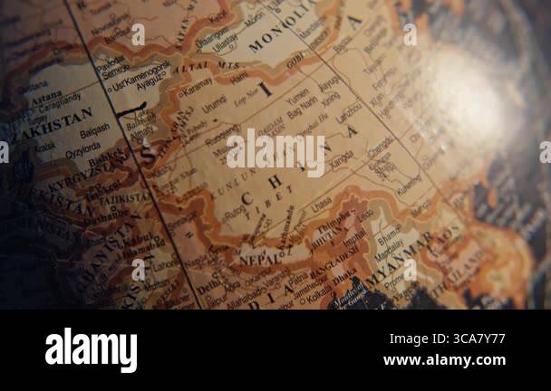 Detailed geographical elements on vintage globe closeup. Macro view ...