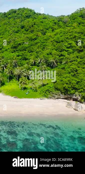 Beautiful landscape of clear water with waves on sandy beach. Carabao ...