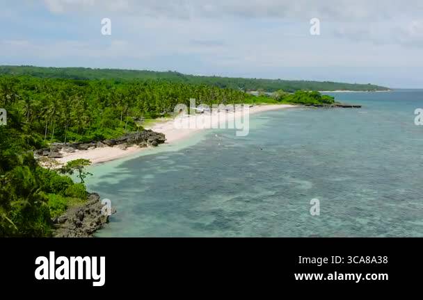 White beach and turquoise sea water and coral reefs. Carabao Island ...