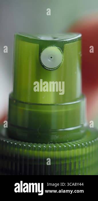 Close up of a green spray bottle cap featuring nozzle details Stock ...
