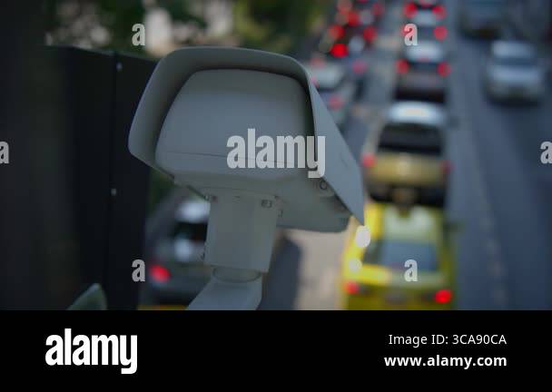 A traffic camera monitors a congested road to improve safety and ...