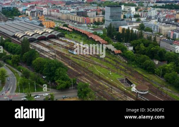 Drone flyover of the Wroclaw Glowny station with suburban city train ...