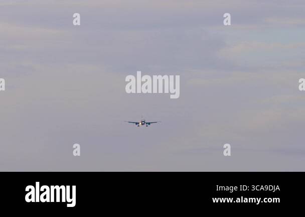 Passenger jet descending on final approach before landing. Travel and ...