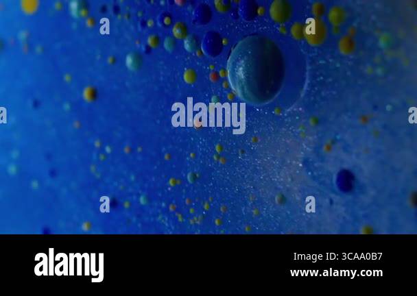 Vertical video. Blue flow. Bubble emulsion. Multicolor acrylic spheres ...
