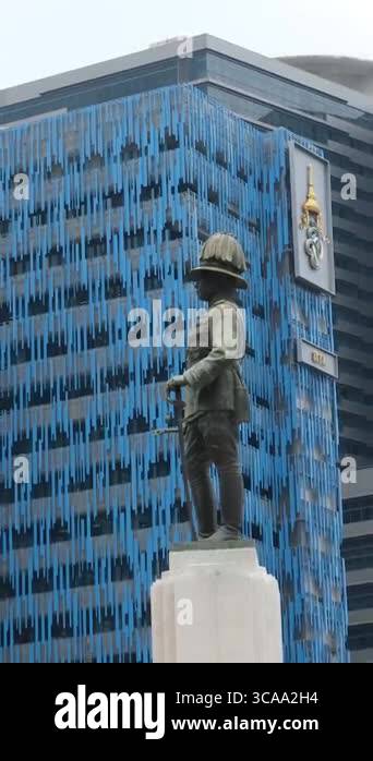 downtown bangkok skyscrapers taxi cars statue monument daytime sky ...