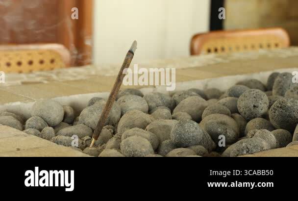 Burning incense stick in rocks indoors, closeup Stock Video Footage - Alamy