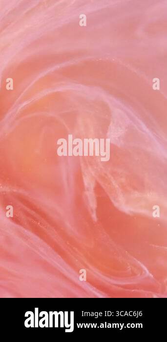 Vertical video. Paint splash water. Vapor twirl. Defocused bright peach ...