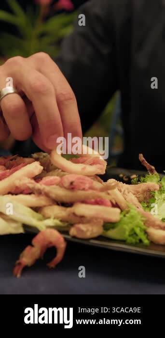 Man Using Hands To Eat Fried Squid Rings During Dinner Stock Video ...
