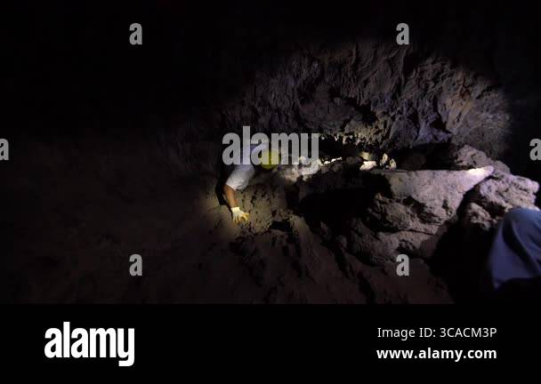 Thunderbolt Cave Caving Man Crawling Through Hole Lava Beds National ...