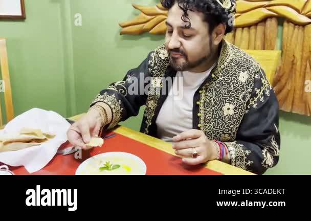 Horizontal 4k video of a Lebanese man enjoying his delicious ...
