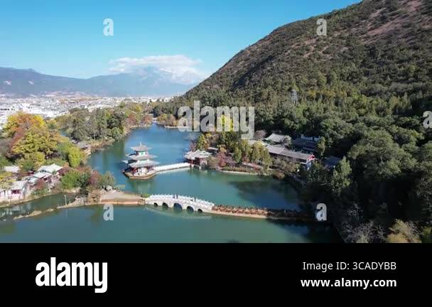 Black Dragon Pool. famous pond with Moon-Embracing Pavilion and bridge ...
