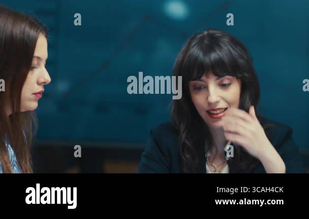 Confident female manager in business attire leading a discussion during ...
